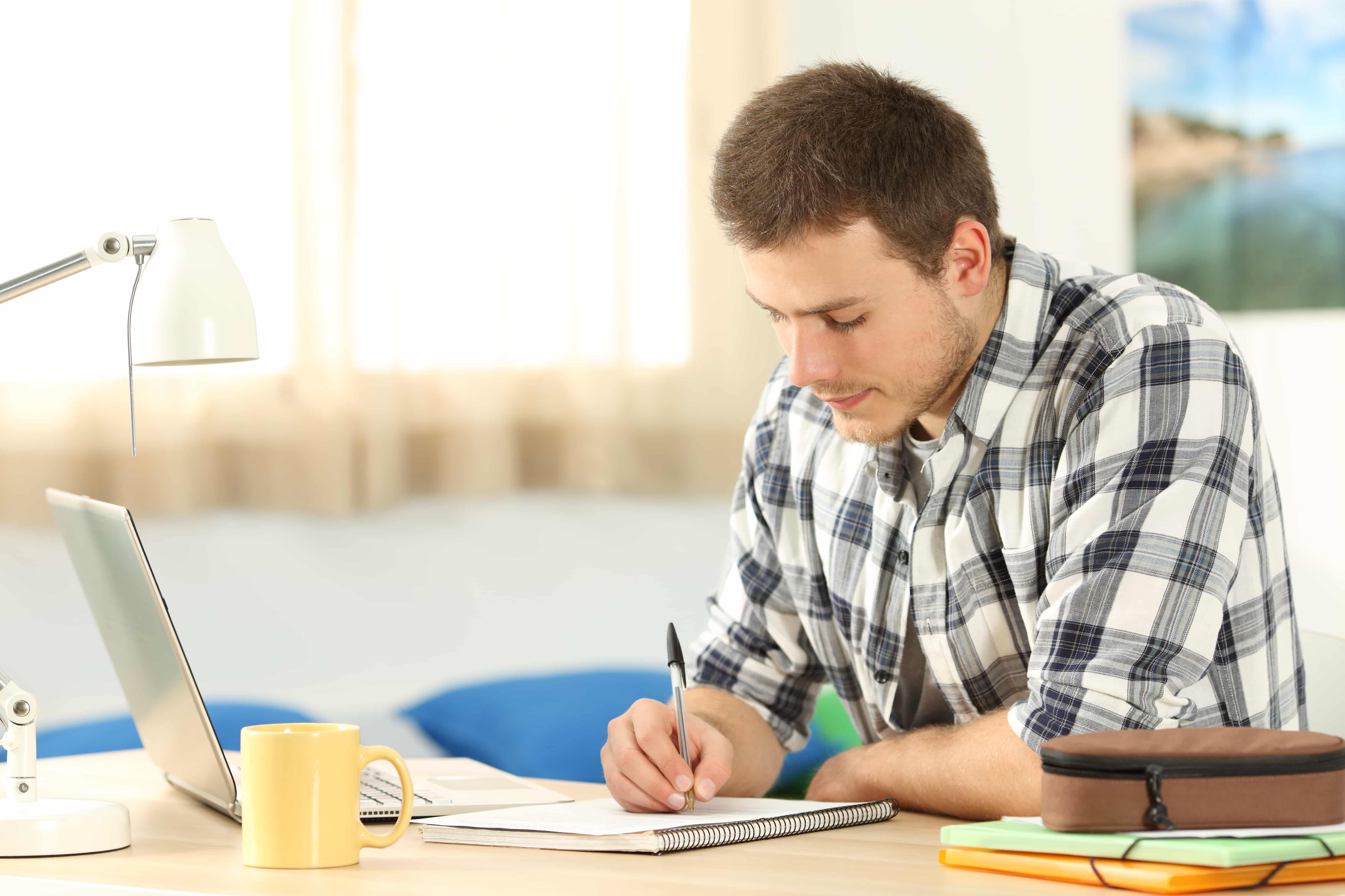 Student doing homework in a desk - How 2 Become